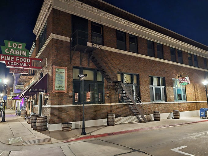 Night or day, that vintage "Log Cabin" sign promises the kind of meal that makes you forget checking your phone for hours.