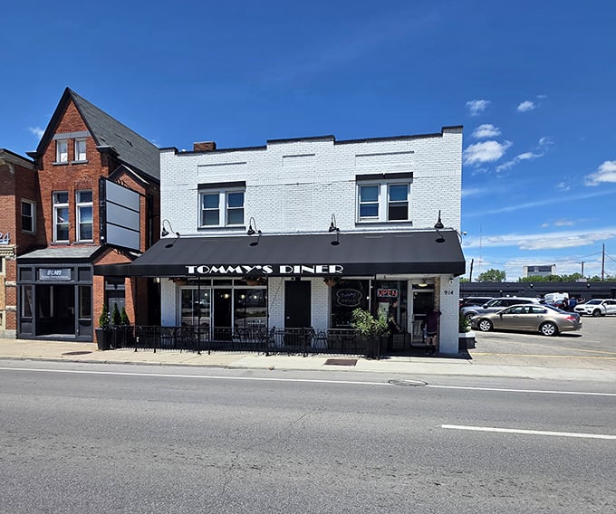 Classic white brick and black awnings &ndash; Tommy's Diner doesn't just serve nostalgia, it IS nostalgia in architectural form.