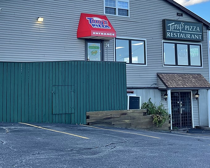 The green sign promises pizza, the building promises no pretension. Tony's is where memories are made one slice at a time.