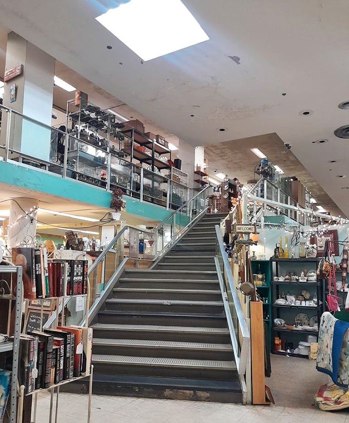 The stairway to heaven? For vintage enthusiasts, this central staircase leads to a second floor of untold wonders and potential discoveries.