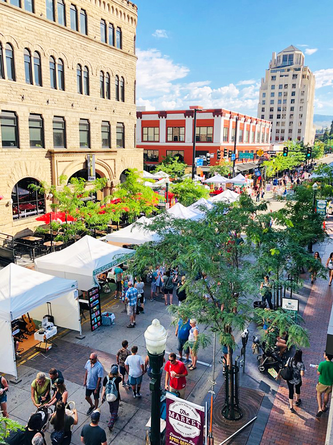 From this bird's eye view, the market resembles a living organism, pulsing with energy against Boise's architectural backdrop of historic and modern buildings.