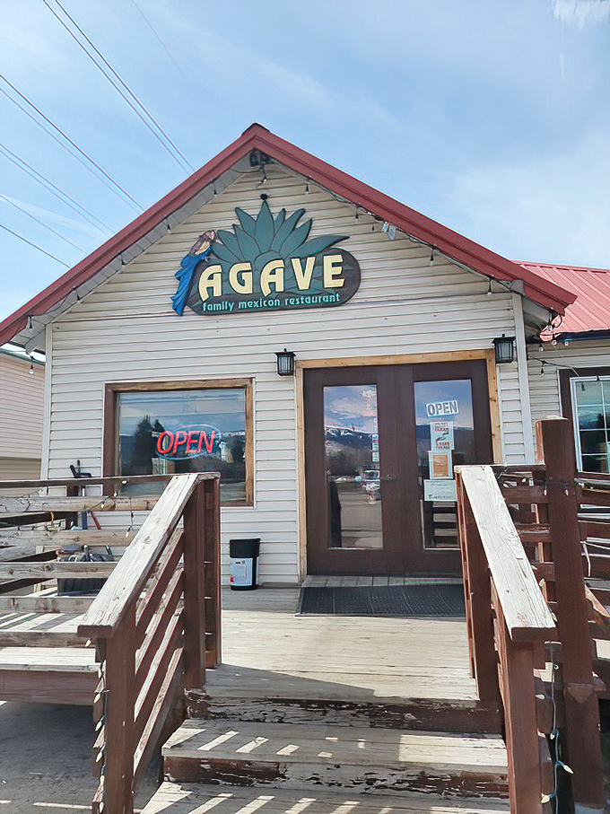 Agave Family Mexican Restaurant welcomes you with a wooden deck that's seen more stories than a bartender on Saturday night. The blue agave sign hints at authentic flavors waiting inside.