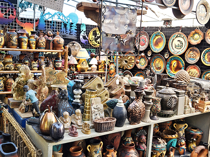 Pottery paradise! This booth transforms ordinary shelves into a museum of Southwestern artistry where every piece tells a different desert story.
