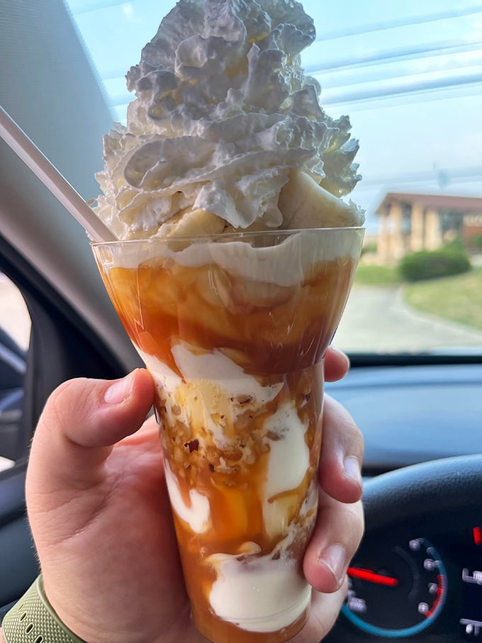 This Bananas Foster parfait isn't just dessert, it's architecture—layers of custard, caramel, and whipped cream creating the Taj Mahal of treats.