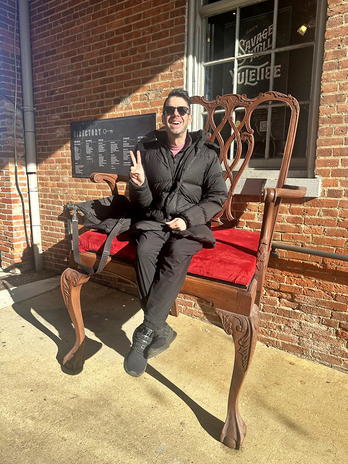 That moment when you find the perfect throne! This ornate wooden chair outside the mill invites royal posing for antique enthusiasts.