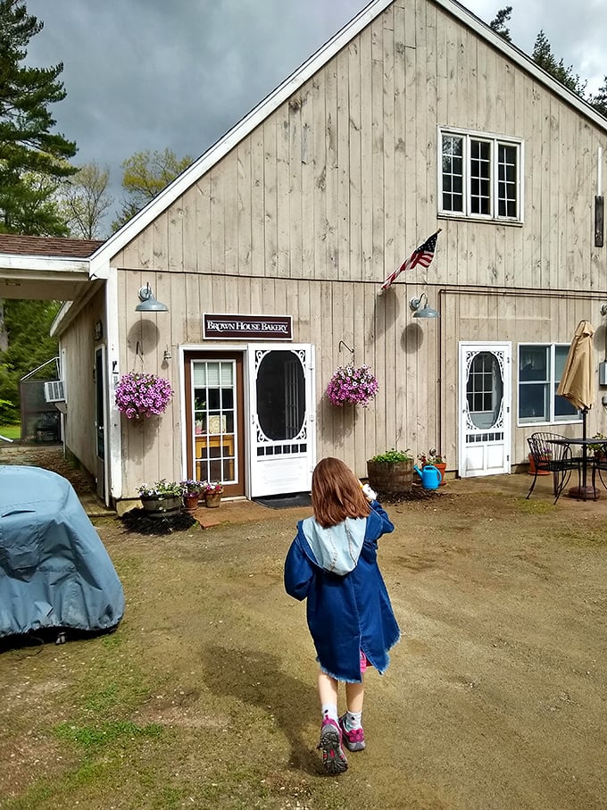 Nothing says "small-town charm" like a bakery with hanging flower baskets. The screen door probably makes that perfect summer sound when it closes.