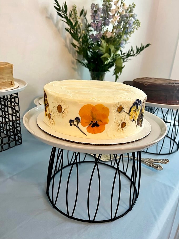 Nature meets artistry on this elegant cake, where pressed flowers transform frosting into a canvas. Dessert or centerpiece? Why choose?