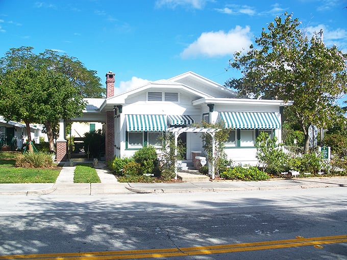Charming bungalows with striped awnings represent Delray's affordable housing options, where Florida dreams don't require Manhattan budgets.