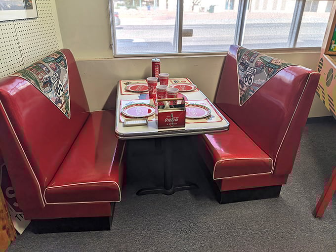 This cherry-red diner booth isn't just furniture&mdash;it's a time machine. One Coca-Cola and suddenly it's 1955 all over again.