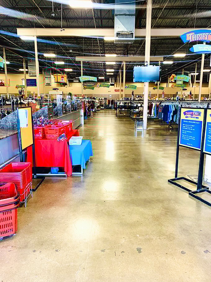 The checkout counter: the finish line where victory is measured in how much you saved rather than how much you spent.