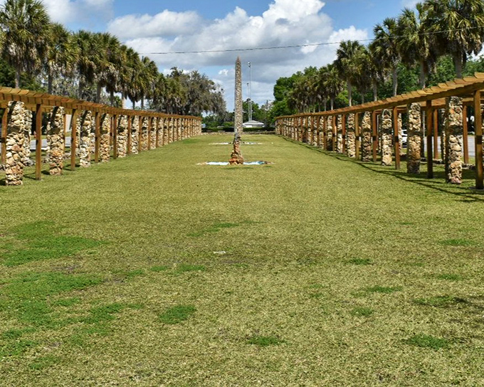 The Court of States stretches before you like a grand European garden that somehow landed in small-town Florida, complete with its own obelisk.