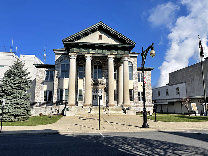 The Alleghany County Courthouse stands proudly with its grand columns, looking like it's ready for its close-up in a period film.
