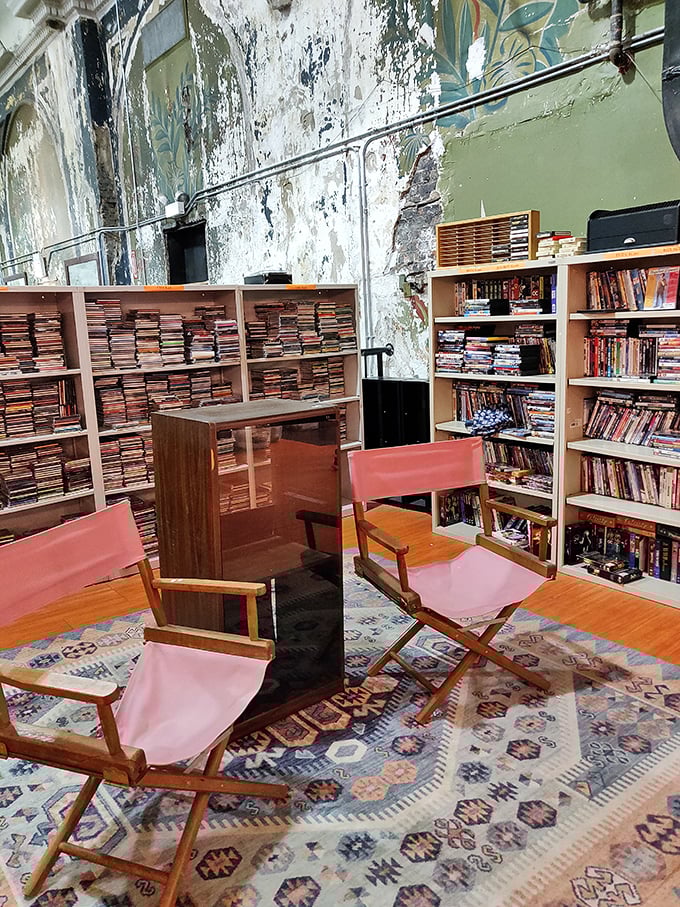 Literary treasures await the patient explorer. These pink director's chairs aren't just seating&mdash;they're front-row tickets to countless stories waiting on those packed shelves.