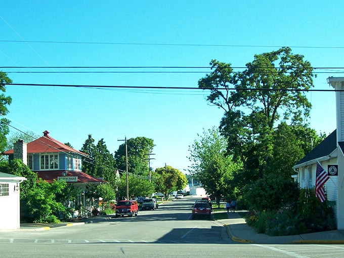 A street where everyone still says good morning to strangers. The kind of downtown where you'll spend more time chatting with shopkeepers than checking your phone.
