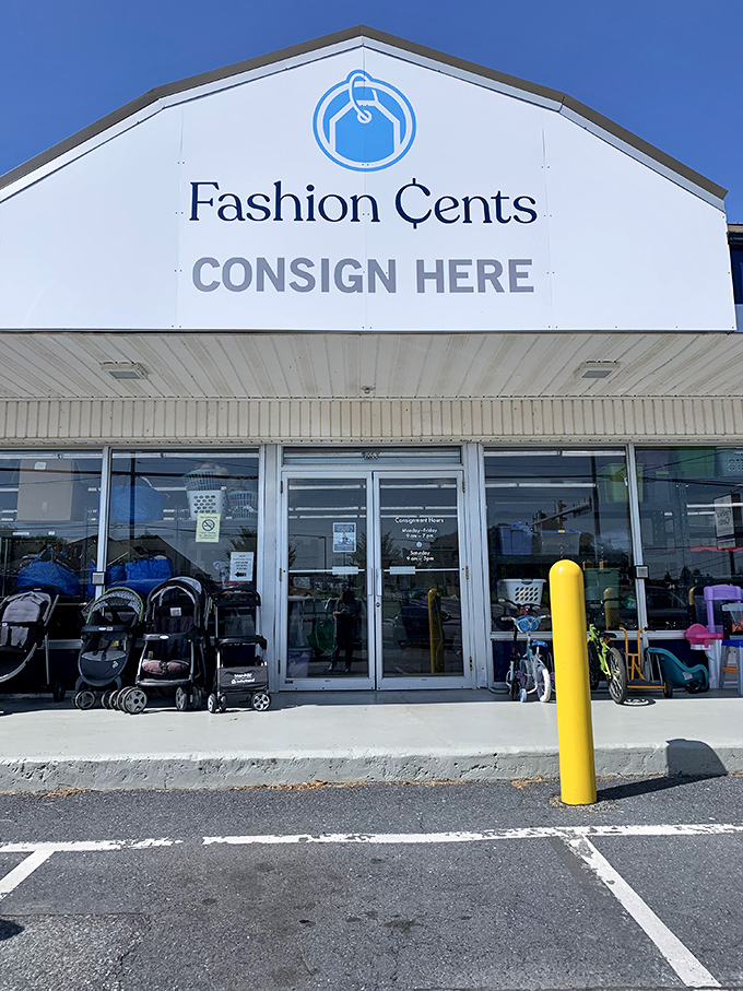 "CONSIGN HERE" beckons from above like a siren call to closet-cleaners everywhere. Outside, strollers await new families while inside, bargains multiply.