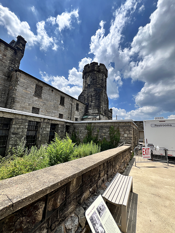 Nature slowly reclaims what man built, with greenery sprouting alongside the stone walls. A poetic reminder that nothing stays locked up forever.