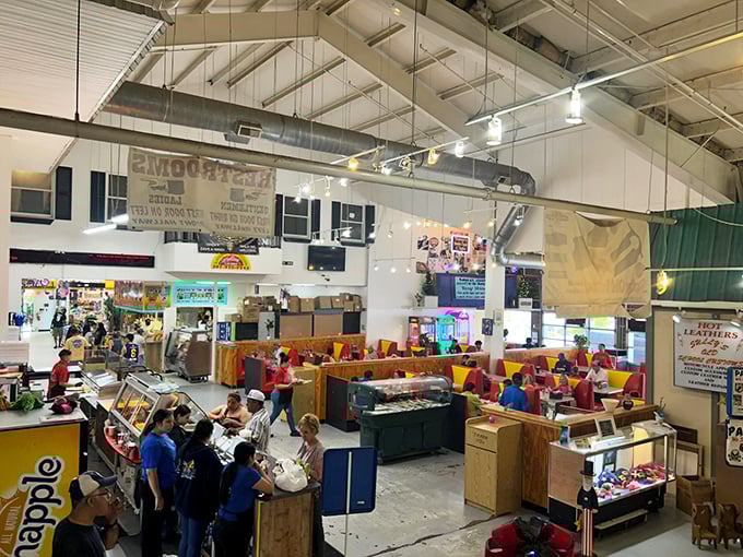 Inside, the market unfolds like a small village, with vendors creating a vibrant tapestry of commerce that buzzes with energy.