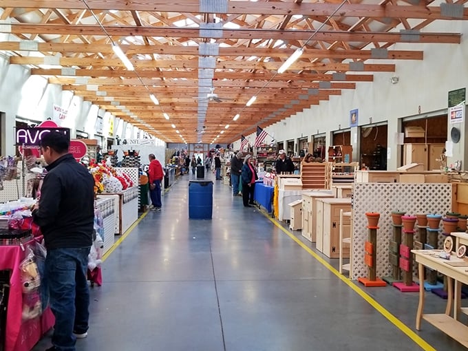Wooden beams stretch overhead like the ribcage of a giant treasure chest, while vendors line the spacious aisles with their carefully curated wares.