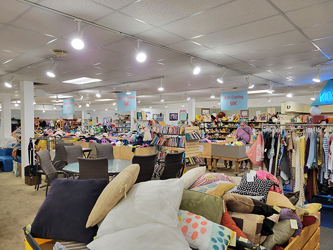 A sea of possibilities awaits inside &ndash; where cushions form their own mountain range and clothing racks stretch toward retail nirvana. 