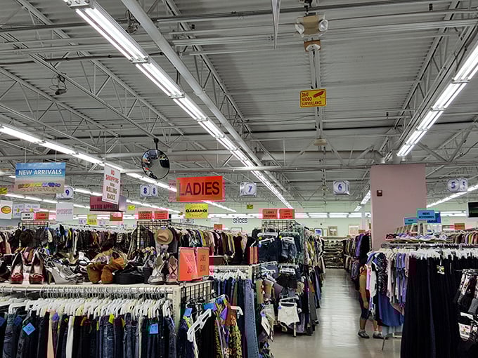 Organized chaos at its finest—racks upon racks of potential wardrobe revivals await under signs that guide you through this labyrinth of lost luxuries.