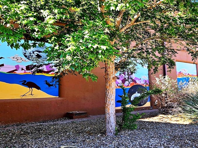 Mother Nature meets artistic expression in this vibrant mural garden, where desert wildlife comes alive in bold colors against adobe walls.