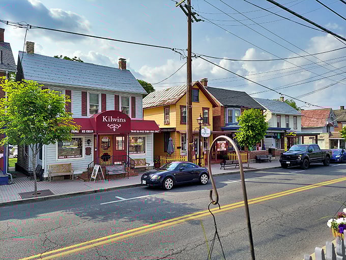 Kilwins and colorful storefronts bring small-town charm to life. It's like Norman Rockwell painted a street and then added ice cream.
