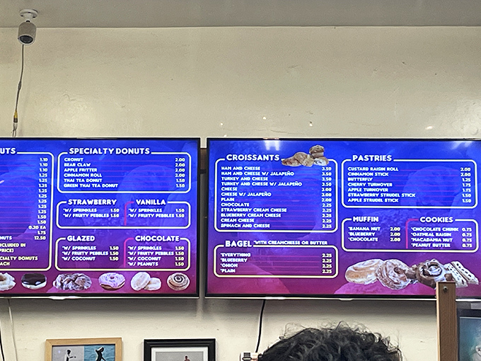 The menu board glows like a treasure map, each entry a potential morning adventure at prices that won't require a second mortgage.