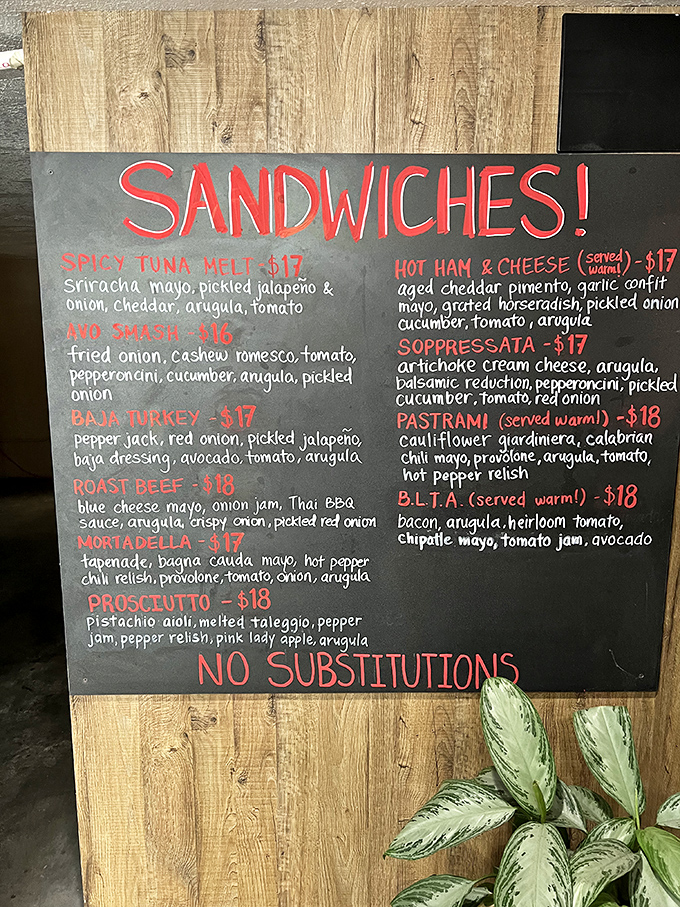 The menu board speaks volumes with its bold "NO SUBSTITUTIONS" declaration. These sandwich architects know exactly what they're doing.