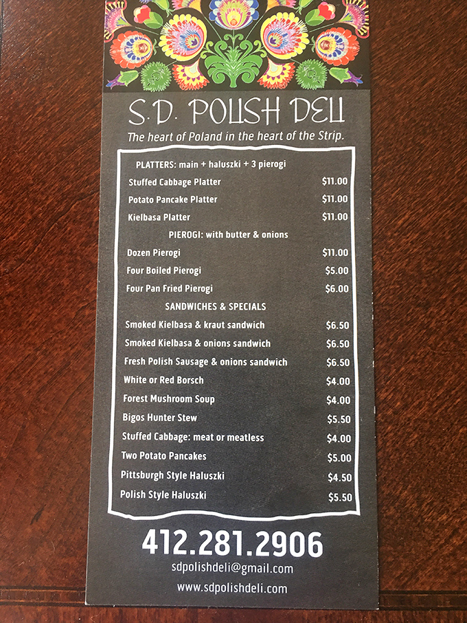 This menu isn't just a list of dishes&mdash;it's a roadmap to happiness. The colorful folk art header is just a preview of the flavor explosion to come.