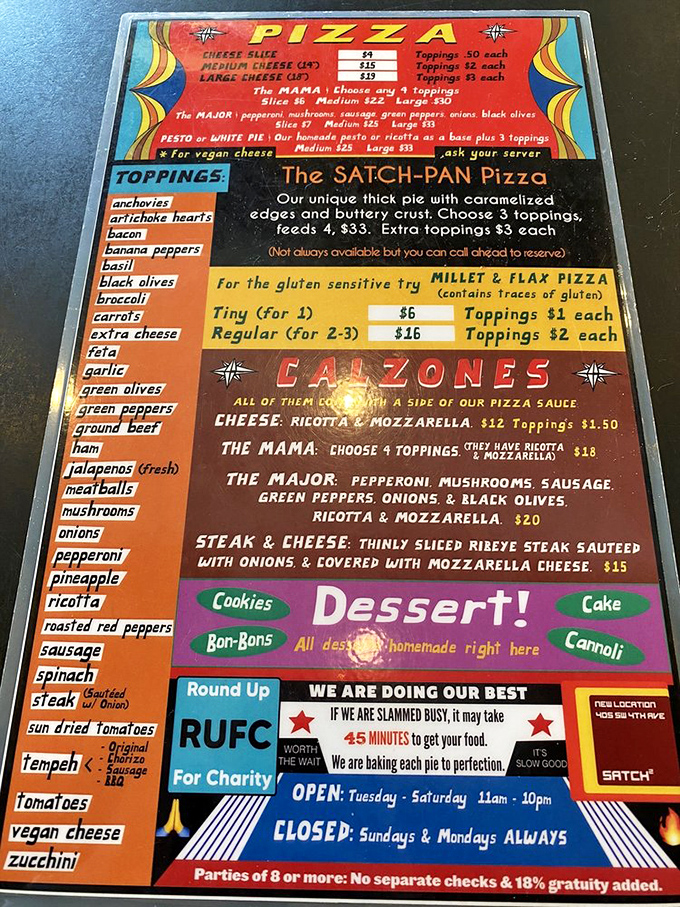 A menu that tells it like it is. "We are doing our best" might be the most honest restaurant slogan ever written&mdash;and the Satch-Pan Pizza proves it.