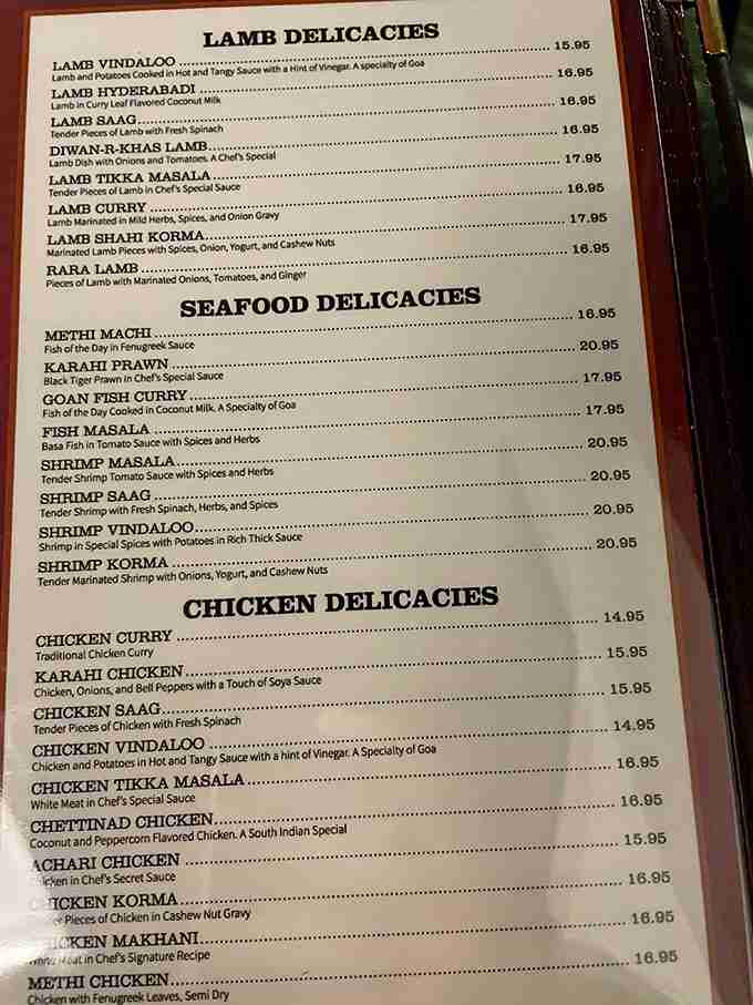 A menu that reads like a love letter to regional Indian cuisine. Each description promises a different journey for your taste buds.