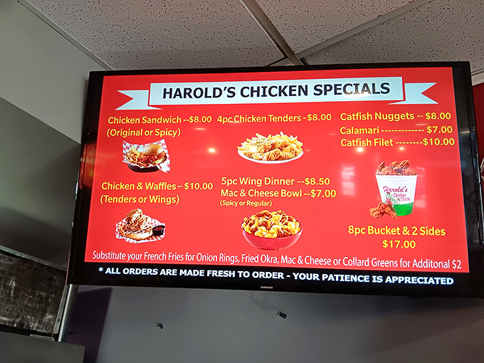 The menu board tells a simple story: chicken is king, but don't sleep on those catfish nuggets or the legendary chicken and waffles combo.