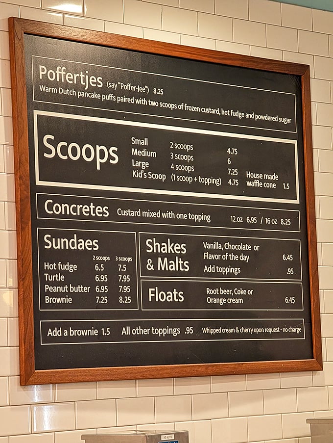 The menu board that launched a thousand cravings. "Poffertjes" might be hard to pronounce, but they're even harder to resist.