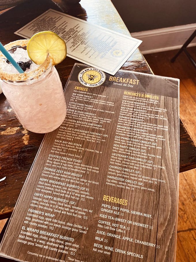 A pink cocktail and wooden menu board&mdash;breakfast served all day is music to the ears of anyone who's ever craved pancakes at 3pm.