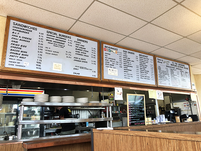 The menu board tells stories of breakfast dreams and late-night cravings. Each illuminated panel a roadmap to satisfaction. 