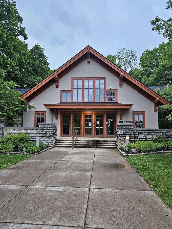 The Nature Center stands as a welcoming basecamp for explorers of all ages, its craftsman-style architecture blending perfectly with the surrounding woodland.