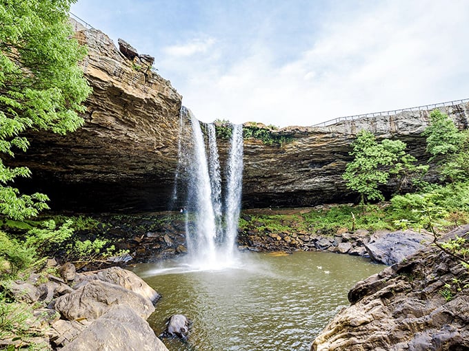 The falls from below reveal their true power &ndash; a thundering cascade carving through ancient stone, creating a natural amphitheater of mist and wonder.