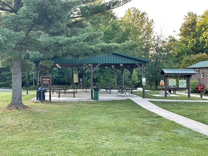 Picnic perfection awaits under this rustic shelter, where many a family reunion has been saved from sudden Midwestern downpours.