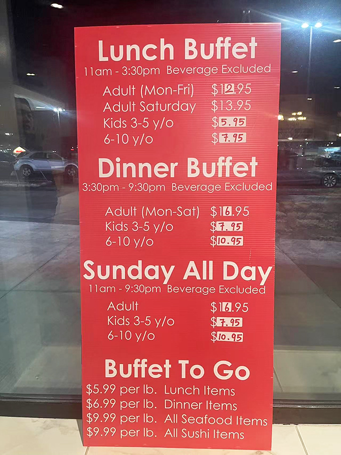 The menu board reveals the buffet's democratic pricing structure. Like a theme park for your taste buds, the admission price grants access to all culinary attractions. 