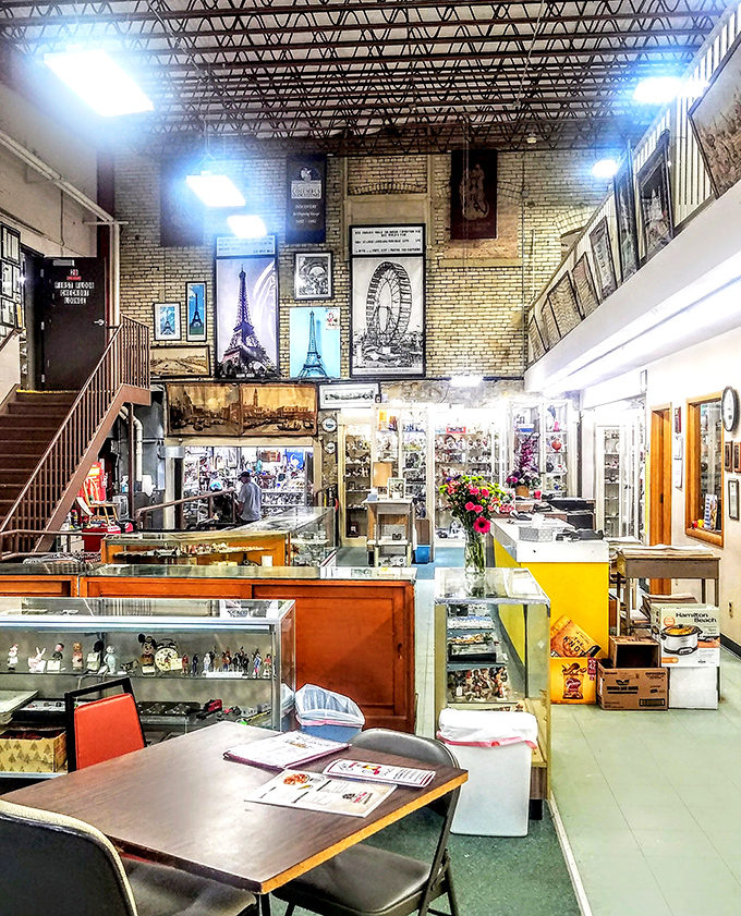 Soaring ceilings and Eiffel Tower artwork create an unexpected grandeur. The front desk alone could tell a thousand stories.