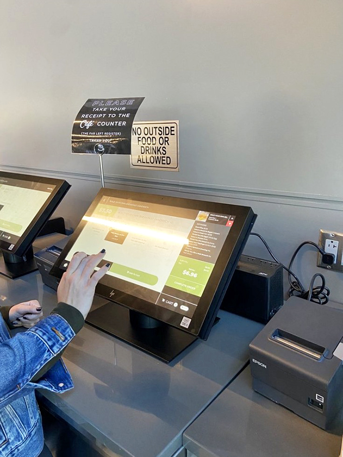 Technology meets tradition at the ordering kiosks. Even the most pastry-overwhelmed visitor can navigate their way to dessert destiny with a few taps.