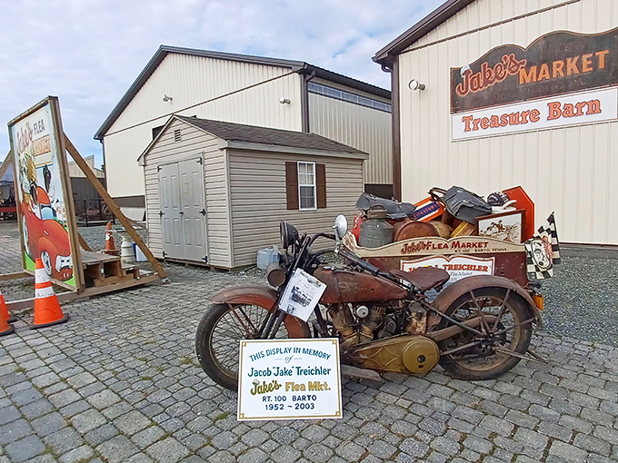 History on display: A vintage motorcycle stands guard outside the "Treasure Barn," where yesterday's ordinary becomes today's extraordinary find.