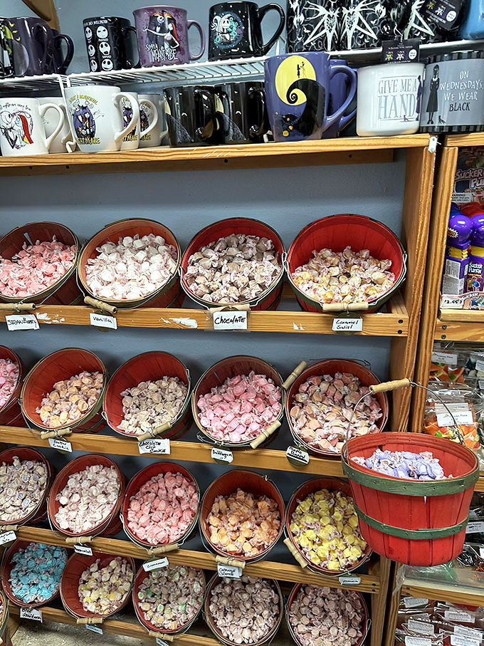 Red baskets of taffy create a color wheel of possibilities. Each twisted wrapper holds a moment of pure, uncomplicated joy.