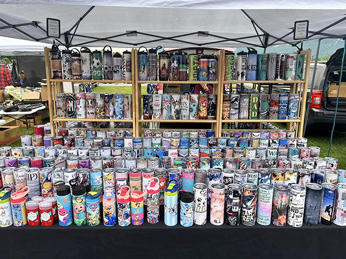A colorful army of tumblers stands at attention. In the flea market hierarchy, one person's beverage container collection is another's artistic display.
