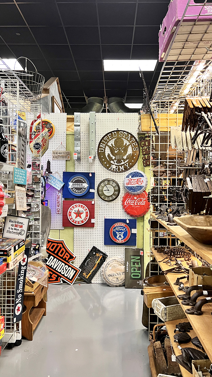 Americana heaven! This wall of vintage signs would make any collector's heart skip a beat—from military emblems to classic Coca-Cola.
