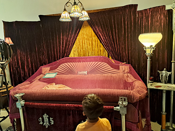 The plush pink viewing bed looks more comfortable than some hotel mattresses I've encountered, though the checkout time is considerably more permanent.