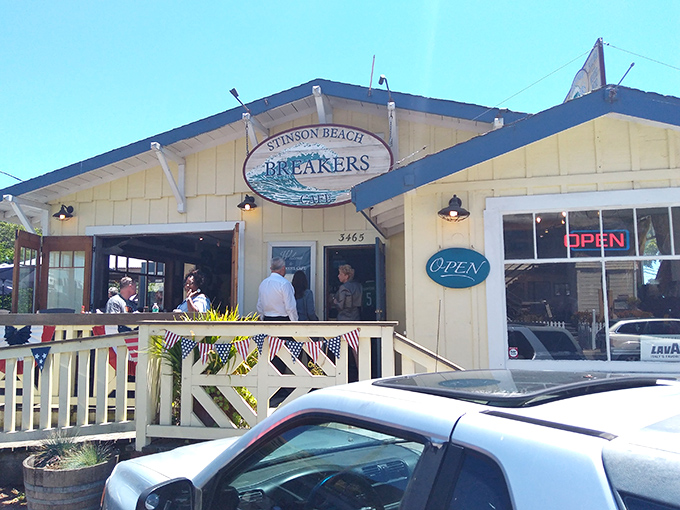 Breakers Caf&eacute; welcomes hungry beachgoers with its cheerful yellow facade and promise of post-swim sustenance that'll make you forget your sunburn.