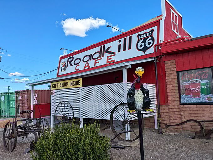 The Roadkill Cafe's vibrant red exterior isn't just a building; it's an exclamation point on the landscape, complete with a roadrunner mascot keeping watch.
