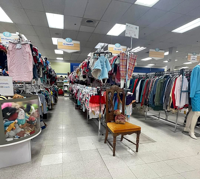Color-coded clothing racks create a rainbow of possibilities where $28 can transform your entire wardrobe. That wooden chair is just taking a shopping break.