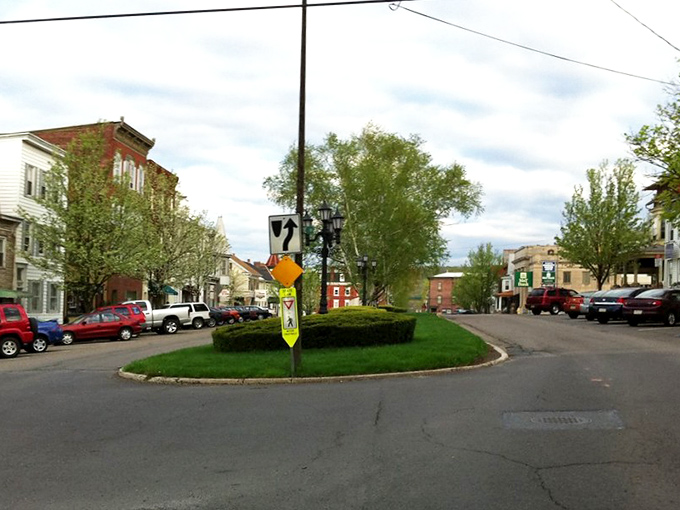 The town square's grassy island feels like Main Street USA's living room—a place where neighbors still wave and gossip travels faster than WiFi.